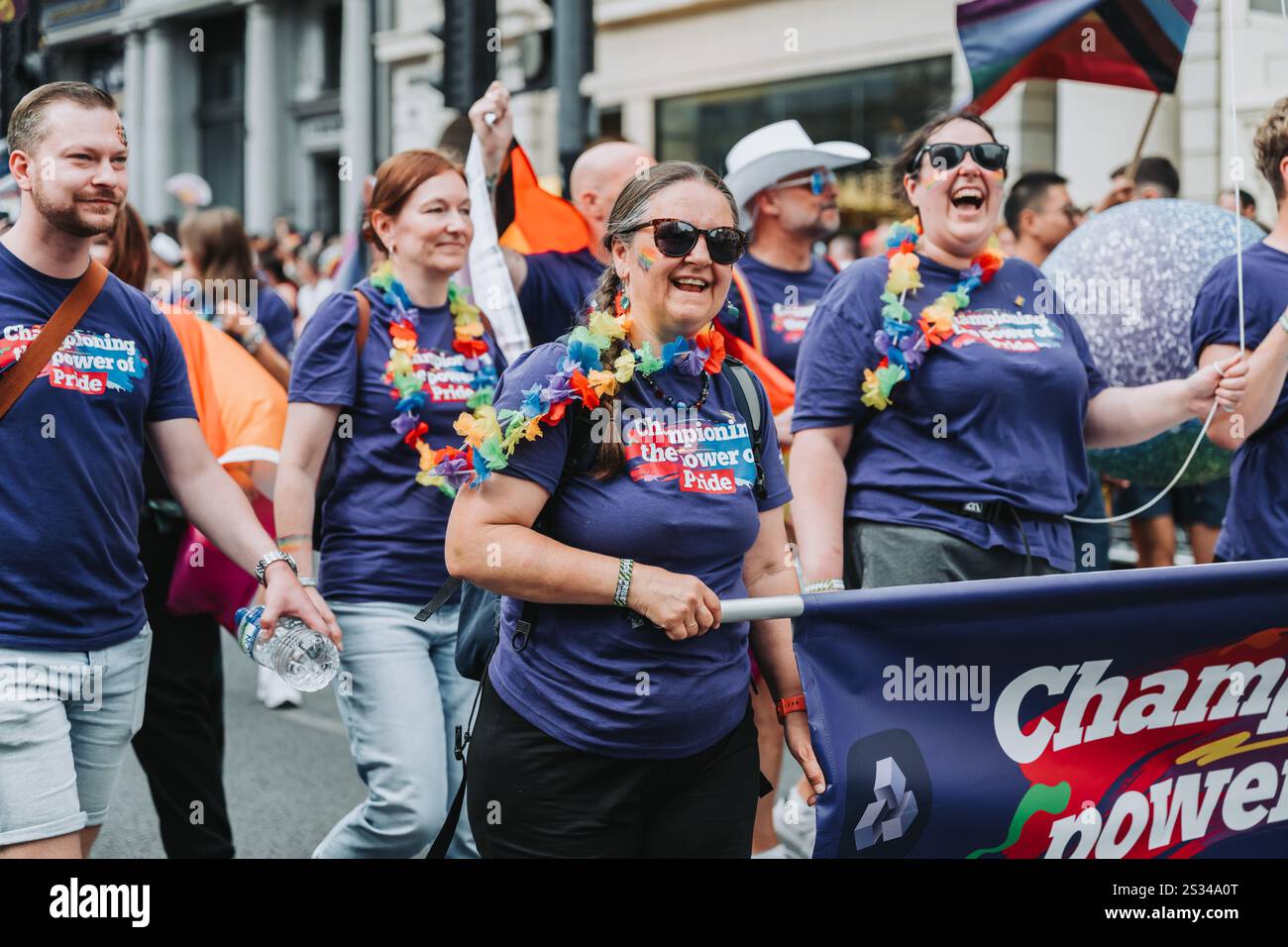 Group of People Marching in a Pride Parade with Joyful Expressions ...