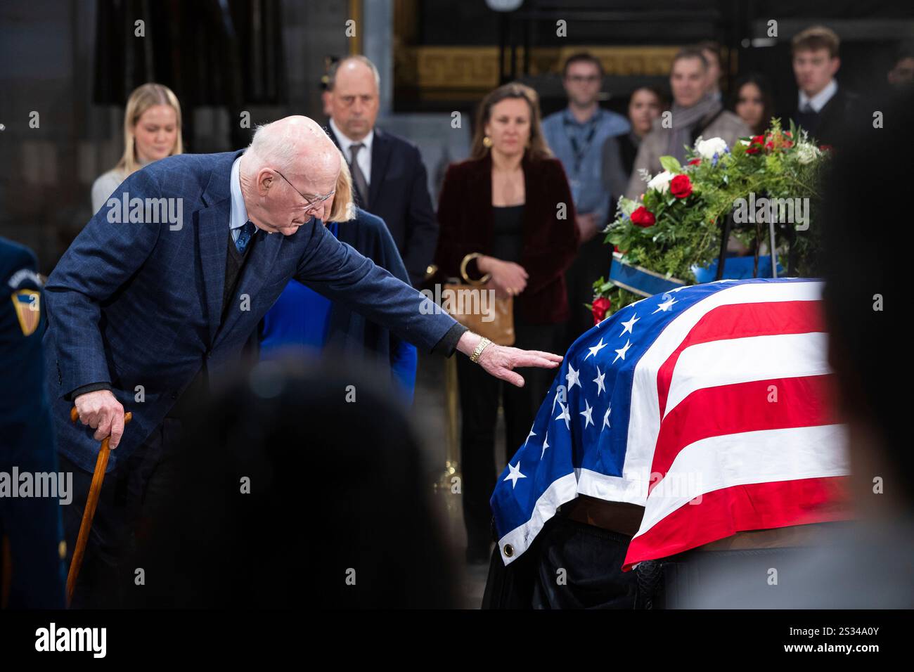 Former Vermont Democratic Senator Patrick Leahy touches the casket of ...