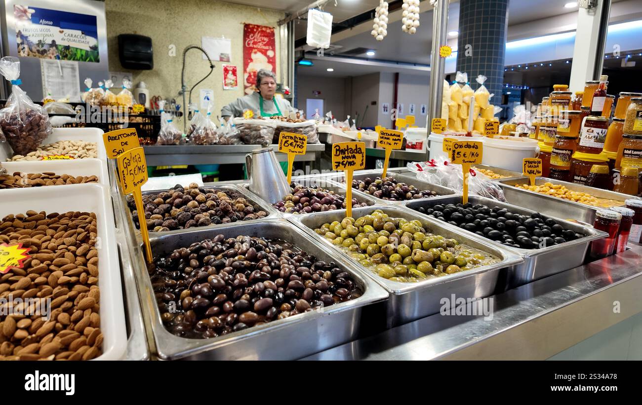 Local residents browse fresh produce inside the Faro Municipal Market ...