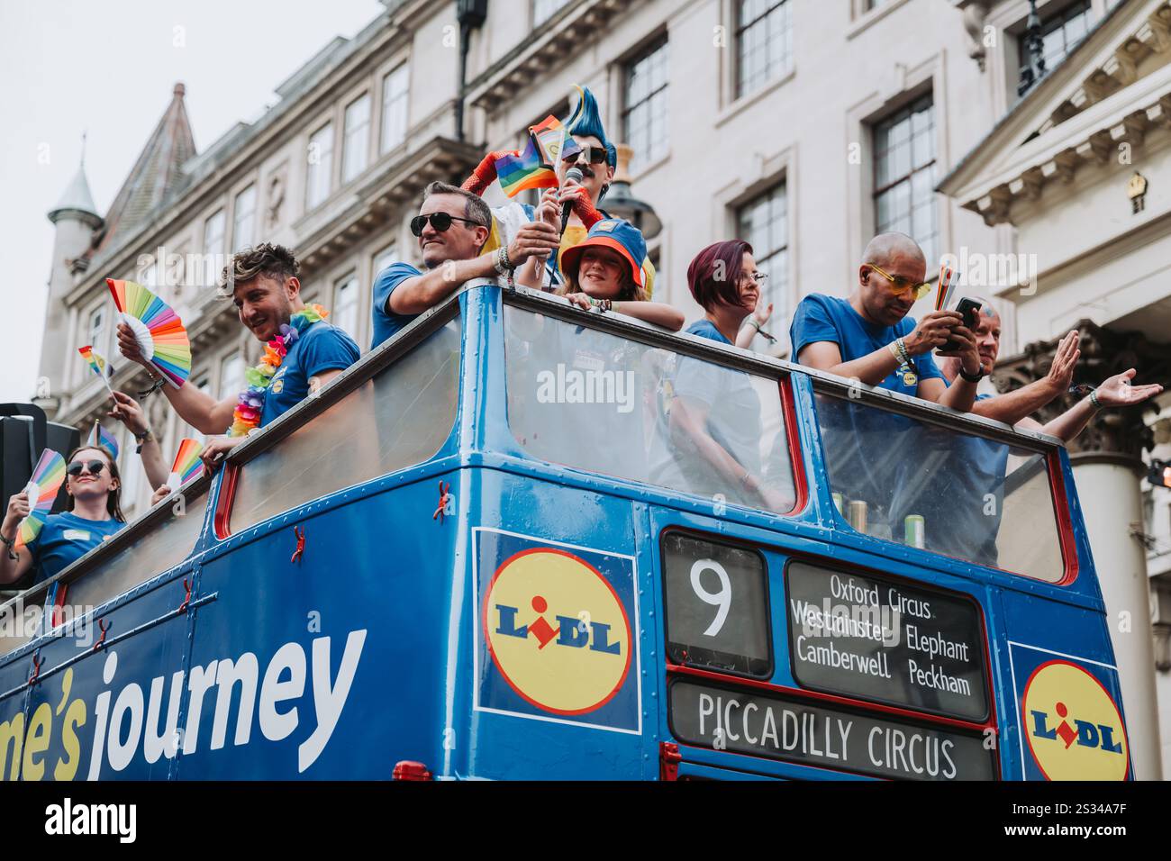 A pride gathering on an open-top double-decker Lidl bus during pride of ...