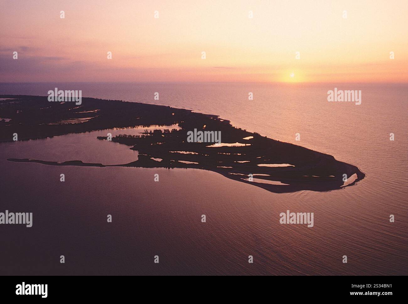 Aerial view of sunset over Presque Isle State Park and Lake Erie ...
