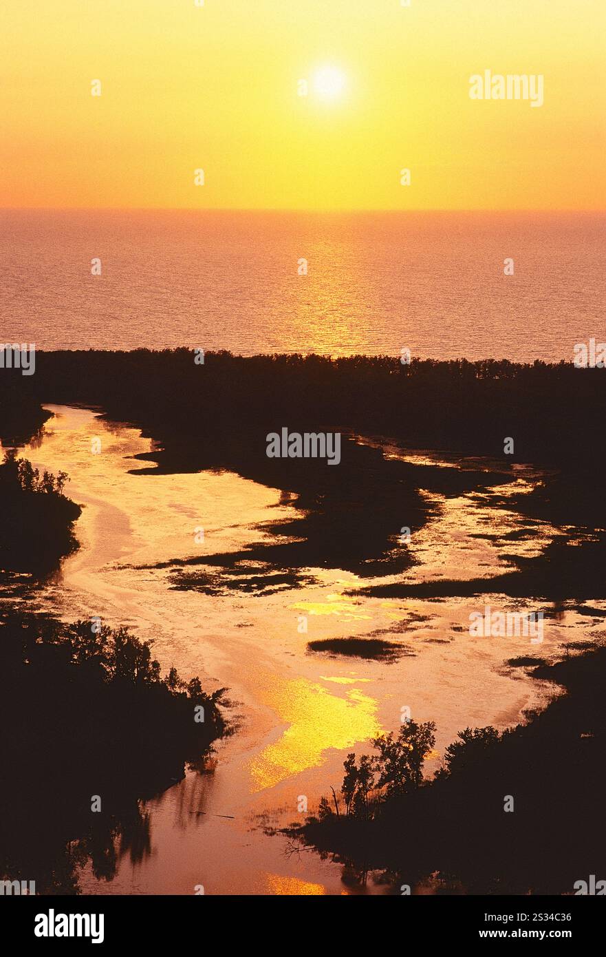 Aerial view of sunset over Presque Isle State Park and Lake Erie ...