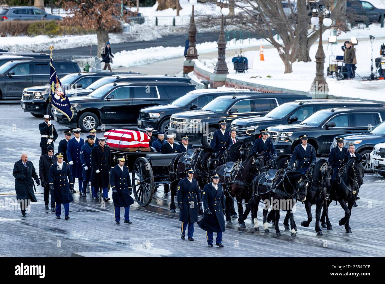 The casket of former US President Jimmy Carter arrives on a horse-drawn ...