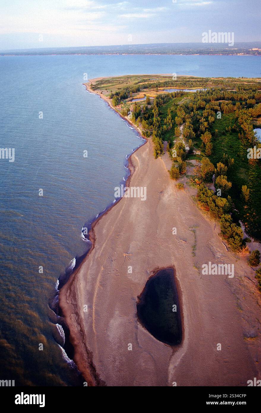 Aerial view of sunset over Presque Isle State Park and Lake Erie ...