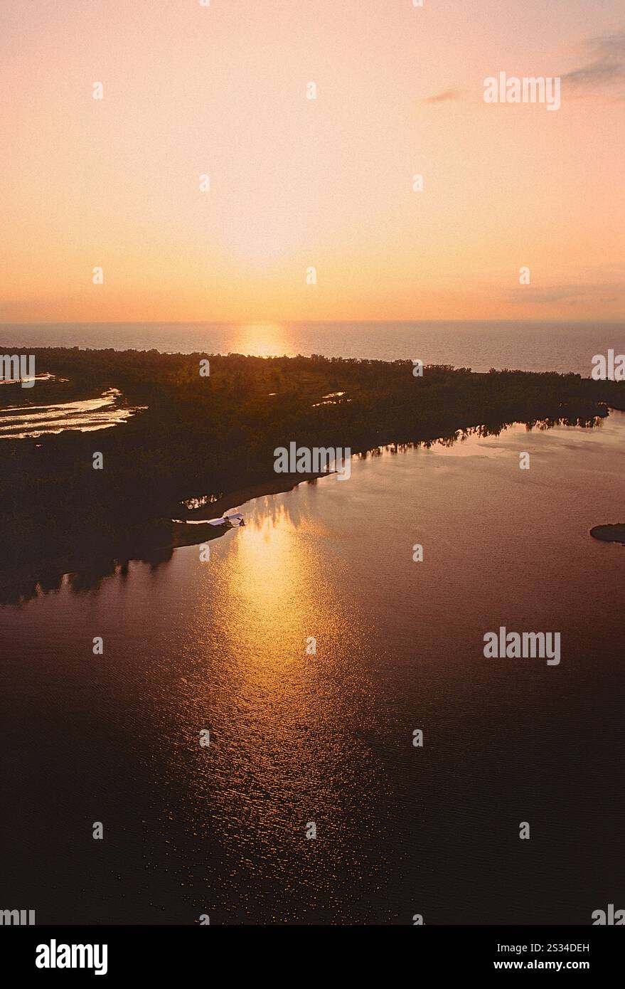 Aerial view of sunset over Presque Isle State Park and Lake Erie ...
