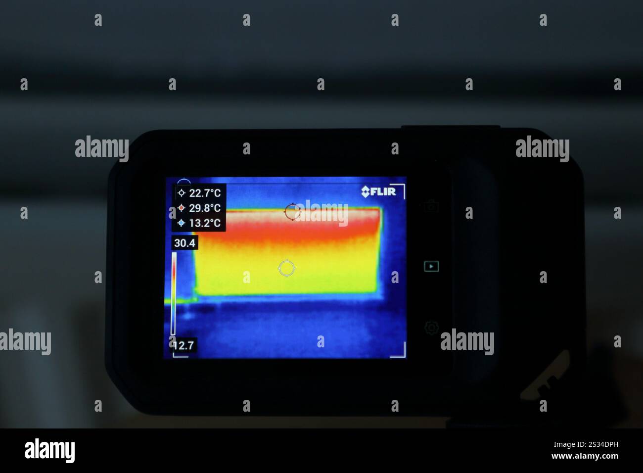Thermal imaging camera showing a central heating radiator FLIR showing ...