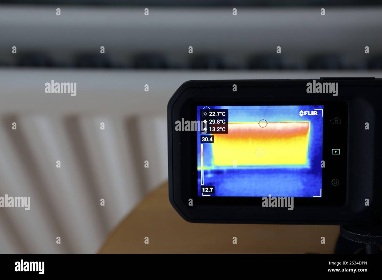 Thermal imaging camera showing a central heating radiator FLIR showing ...