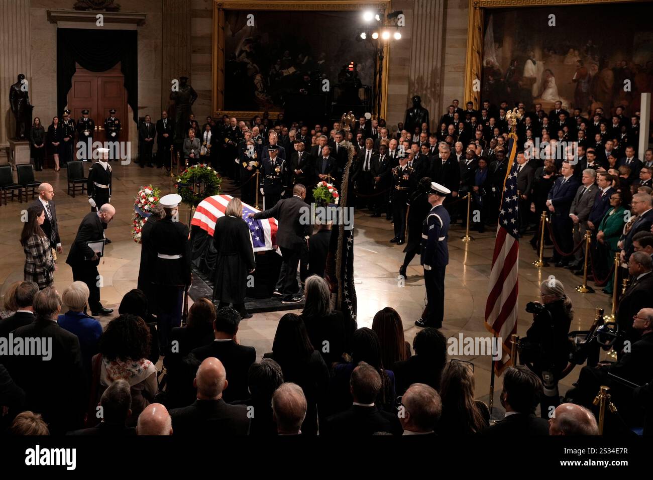 Members of the Carter family pay their respects as the flag-draped ...