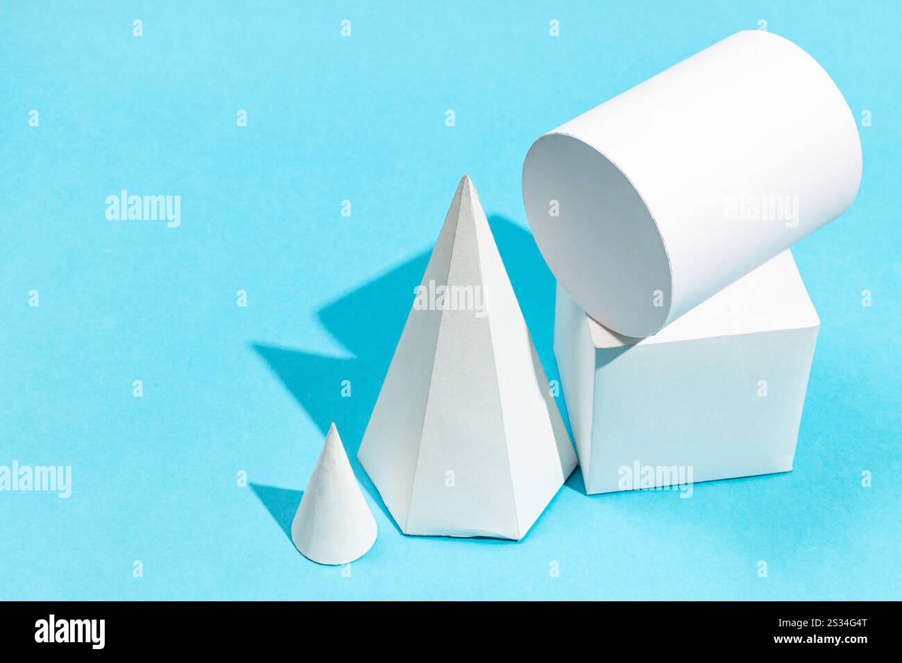 above view of handmade paper geometric models (cone, cube, pyramid ...