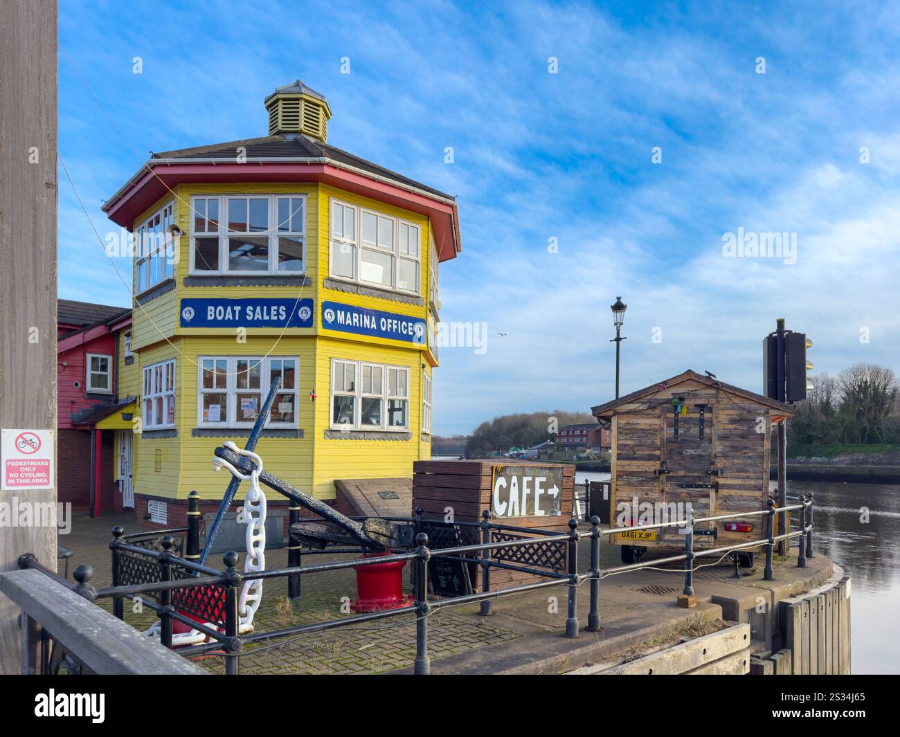 Colorful yellow timber marina office and cafe by the river tyne St ...