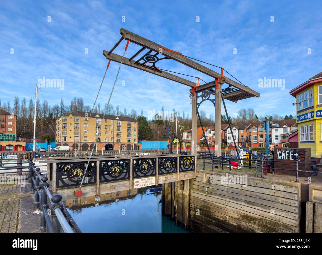 lifting pedestrian wooden bridge St Peters marina basin with moored ...