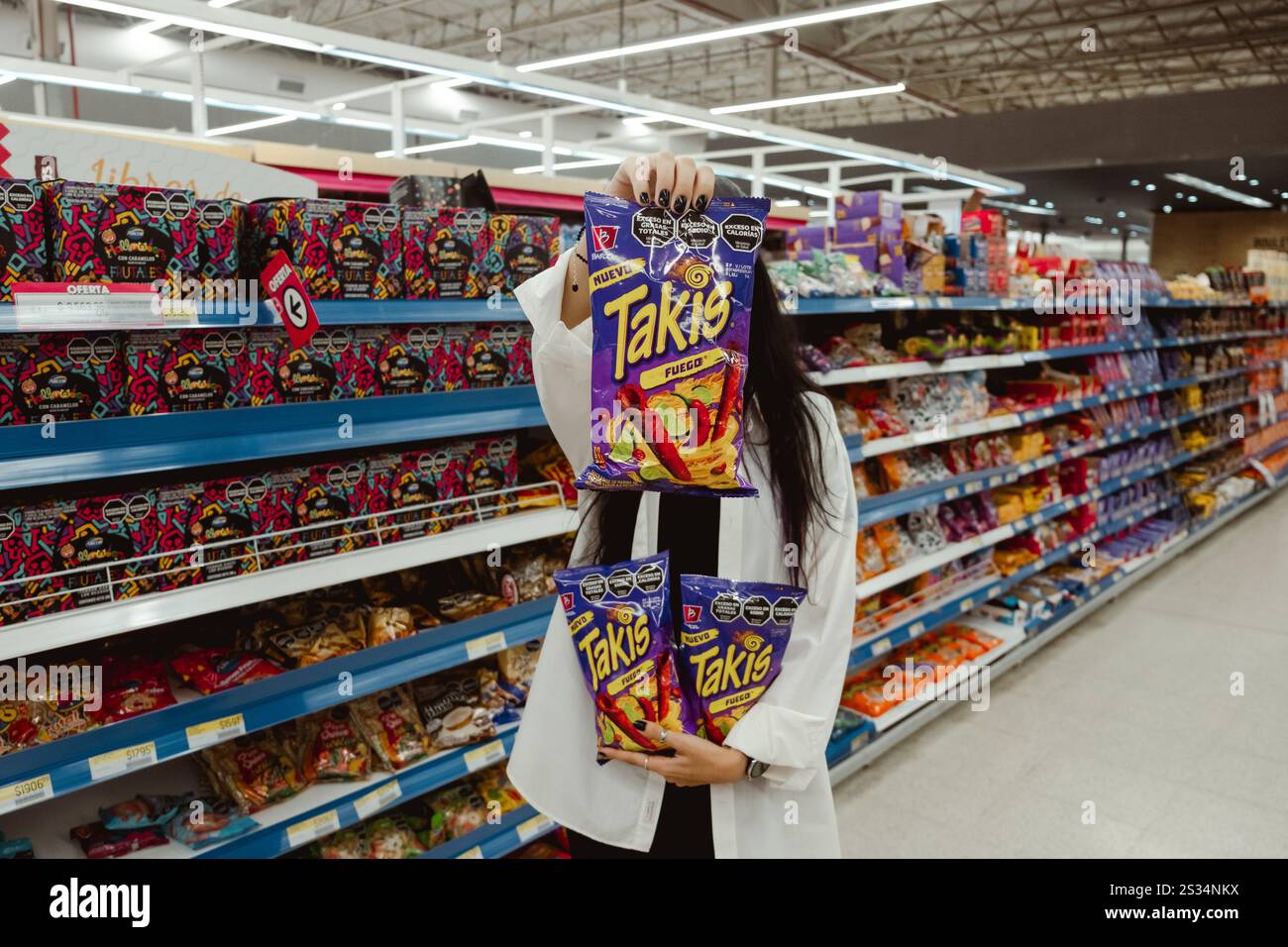 Person Holding a Takis Snack Bag in the Supermarket. Concept Imported ...