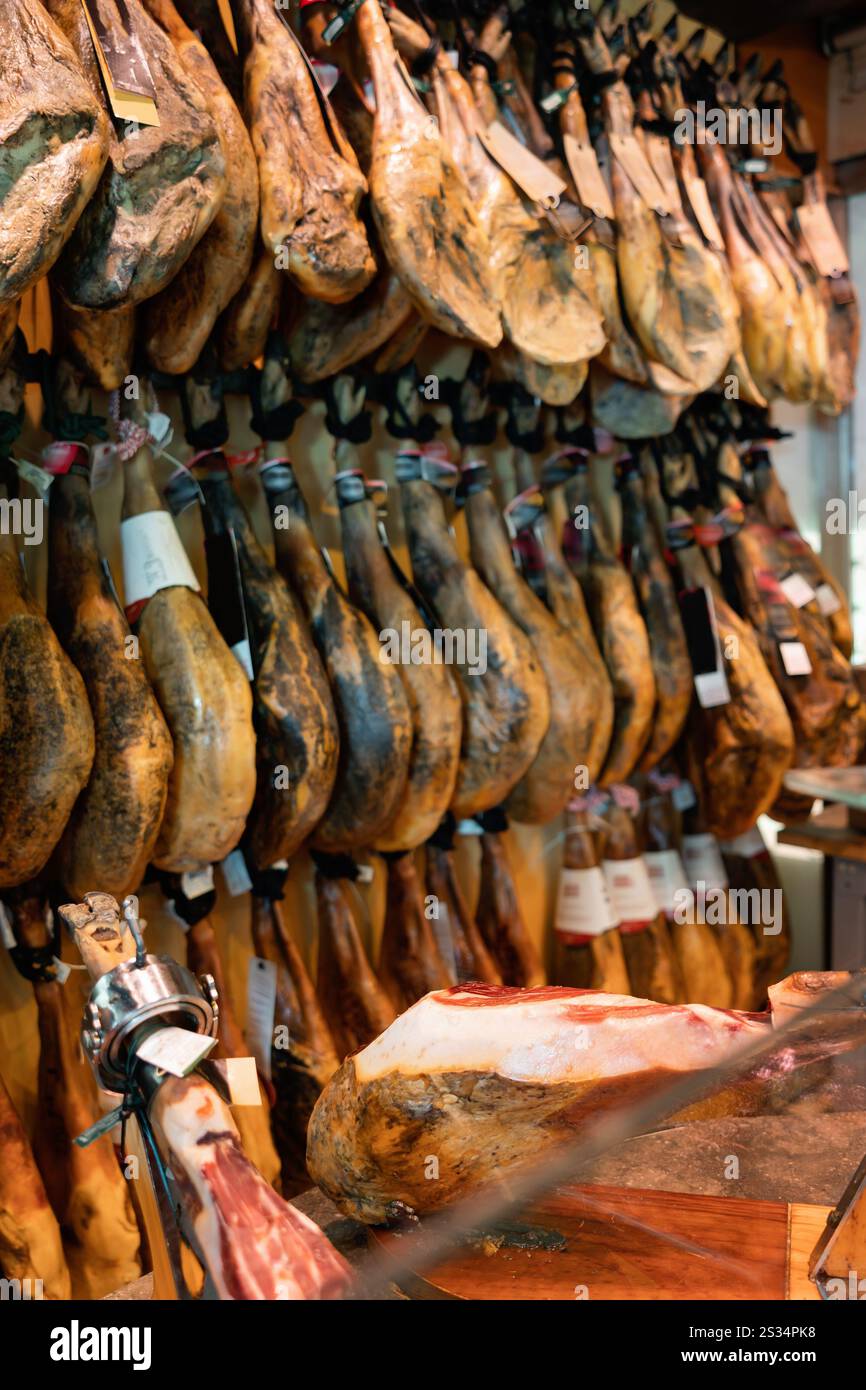 Abundance of dry-cured pig's legs in spanish jamoneria Stock Photo - Alamy