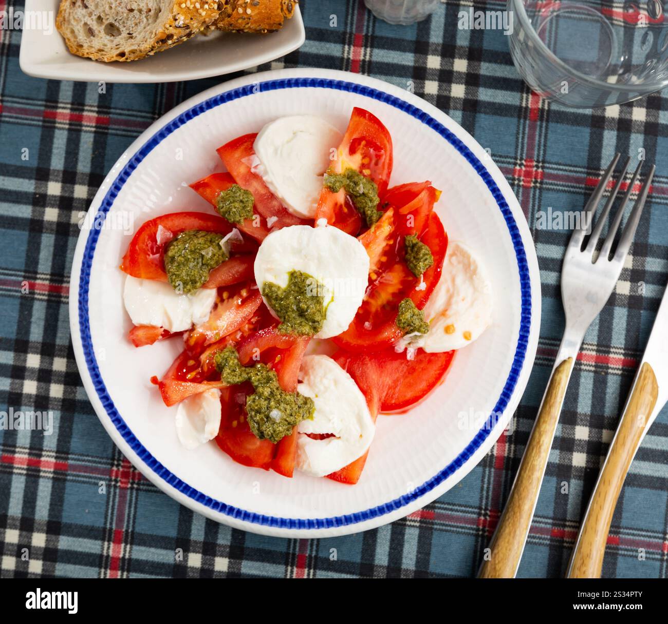 Caprese salad with tomato, mozzarella and balsamic dressing Stock Photo ...