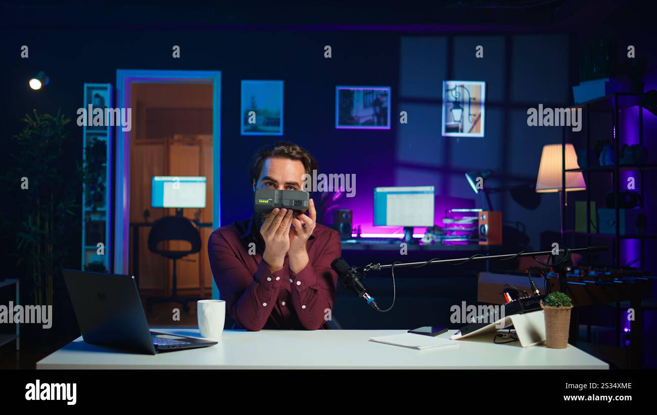 Tech content creator filming technology review of V mount battery ...