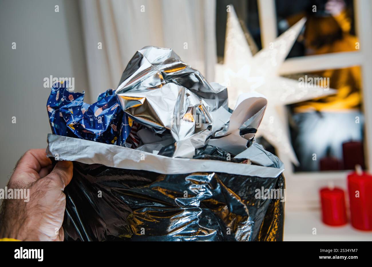 Crumpled metallic and colorful birthday christmas wrapping paper placed ...