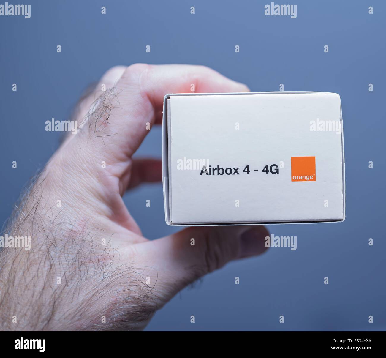 Paris, France - Dec 1, 2024: A close-up of the box for the Orange ...