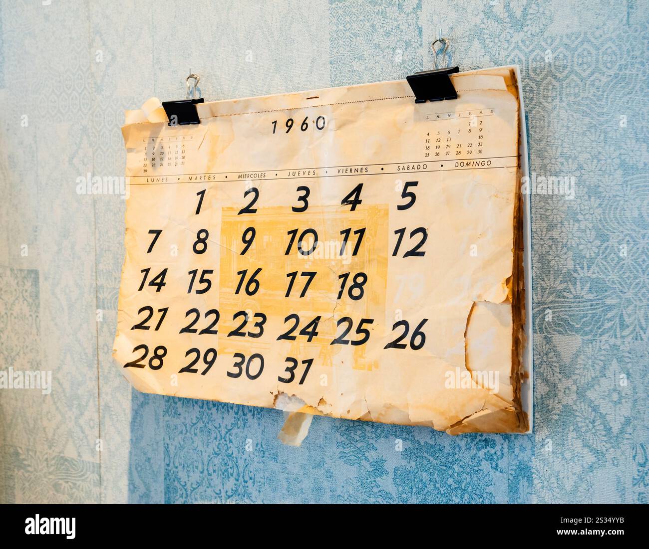 An aged and slightly torn wall calendar from 1960 with bold numbers and ...