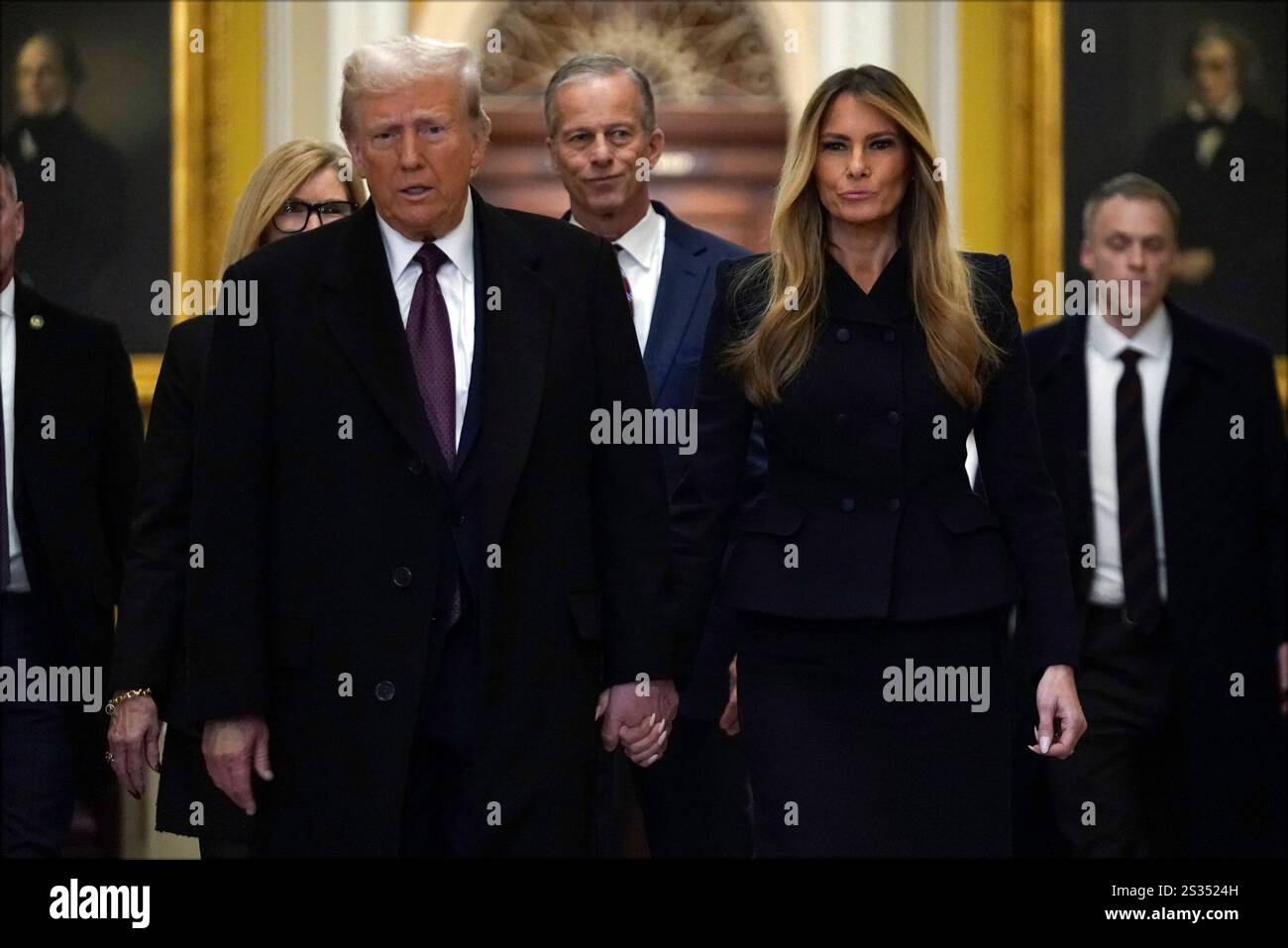 President-elect Donald Trump walks with Melania Trump at the Capitol ...