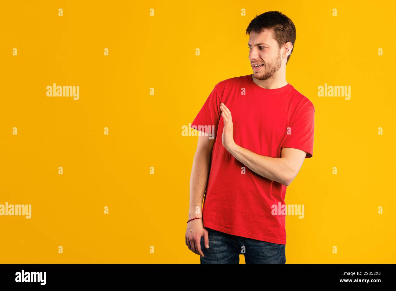 Shocked man with disgusted face showing stop sign Stock Photo - Alamy