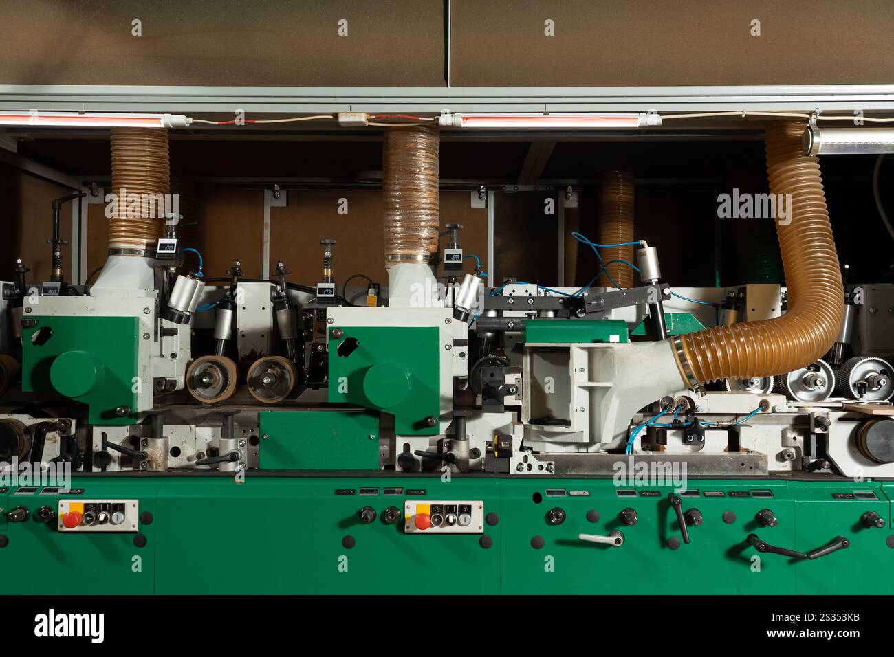 Industrial woodworking machine. Rollers, cutting elements and exhaust ...