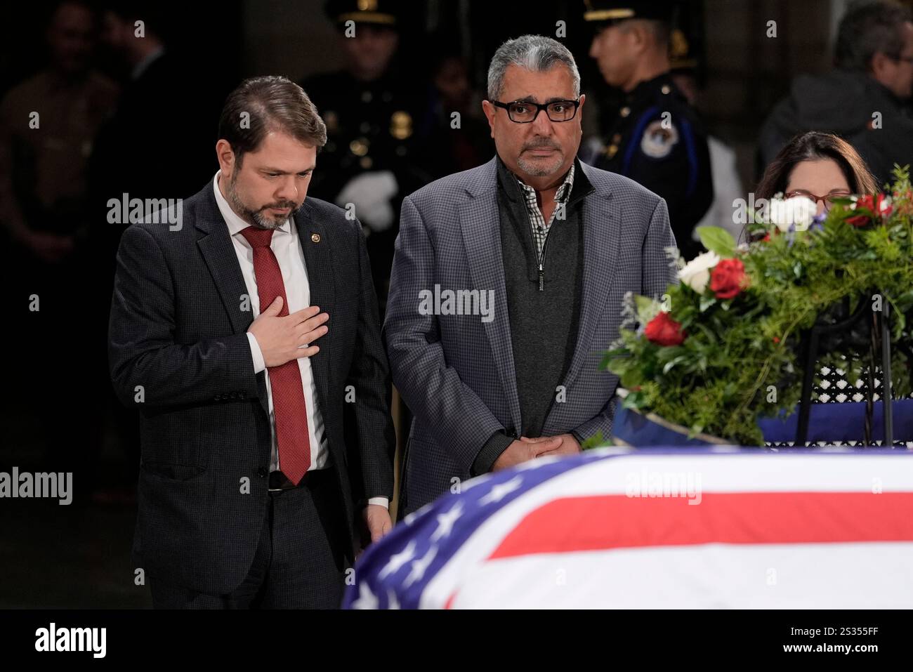 Sen. Ruben Gallego, D-Ariz., pauses at the flag-draped casket of former ...
