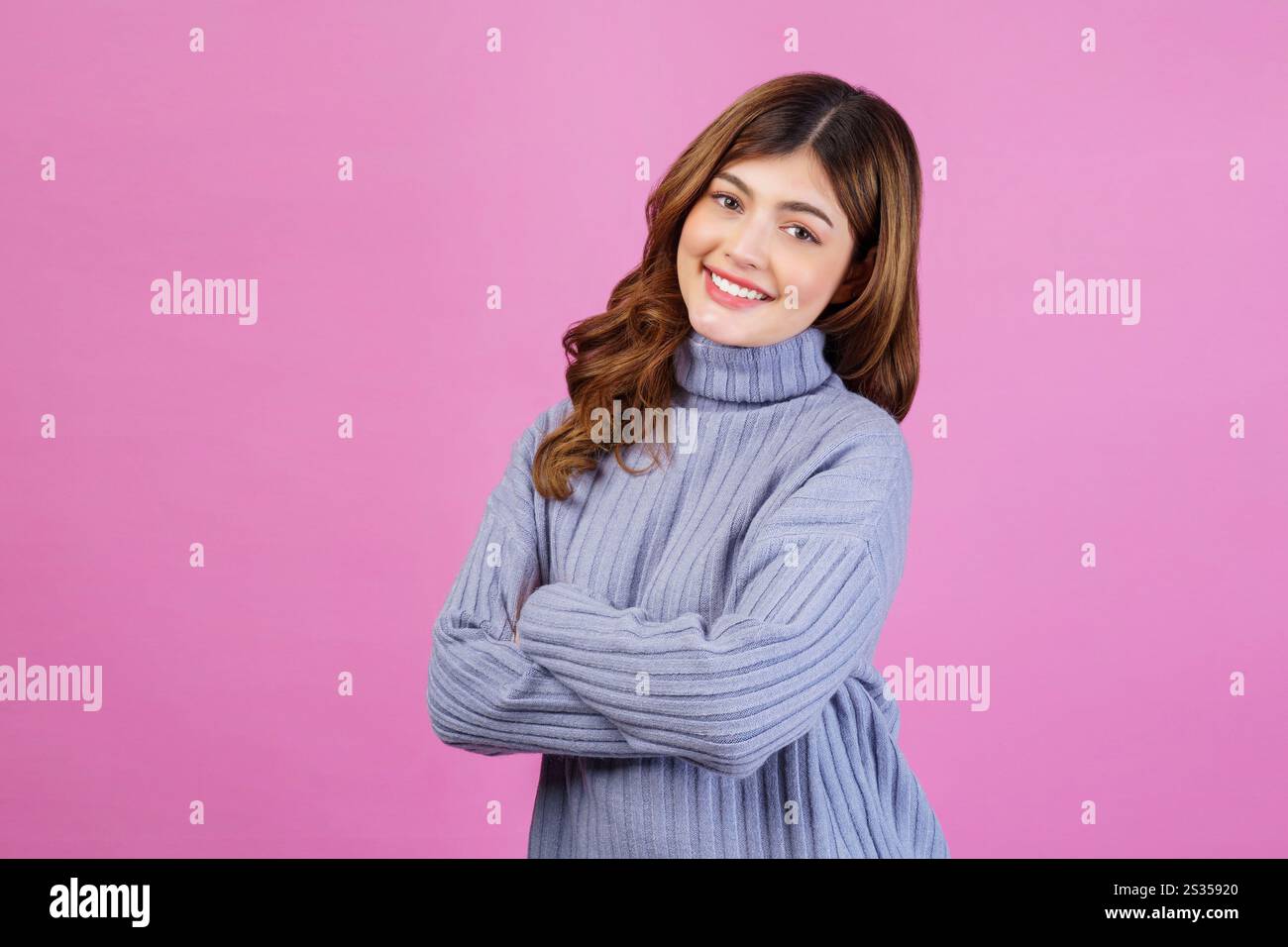 Portrait of Happy young woman cross arm isolated over pink background ...