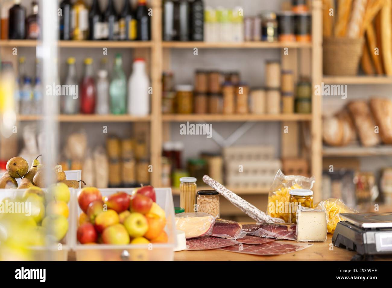Different foods on grocery store counter Stock Photo - Alamy