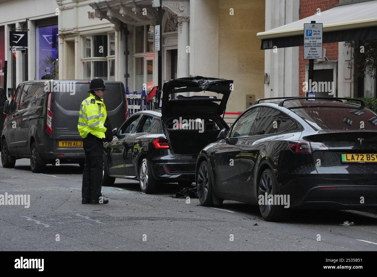 Police set up a cordon as they investigate a suspicious vehicle in ...