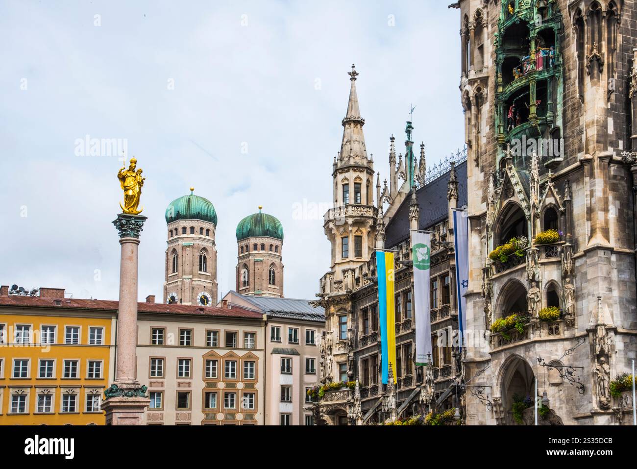 Munich, Marienplatz with town hall facade, Marian column and towers of ...