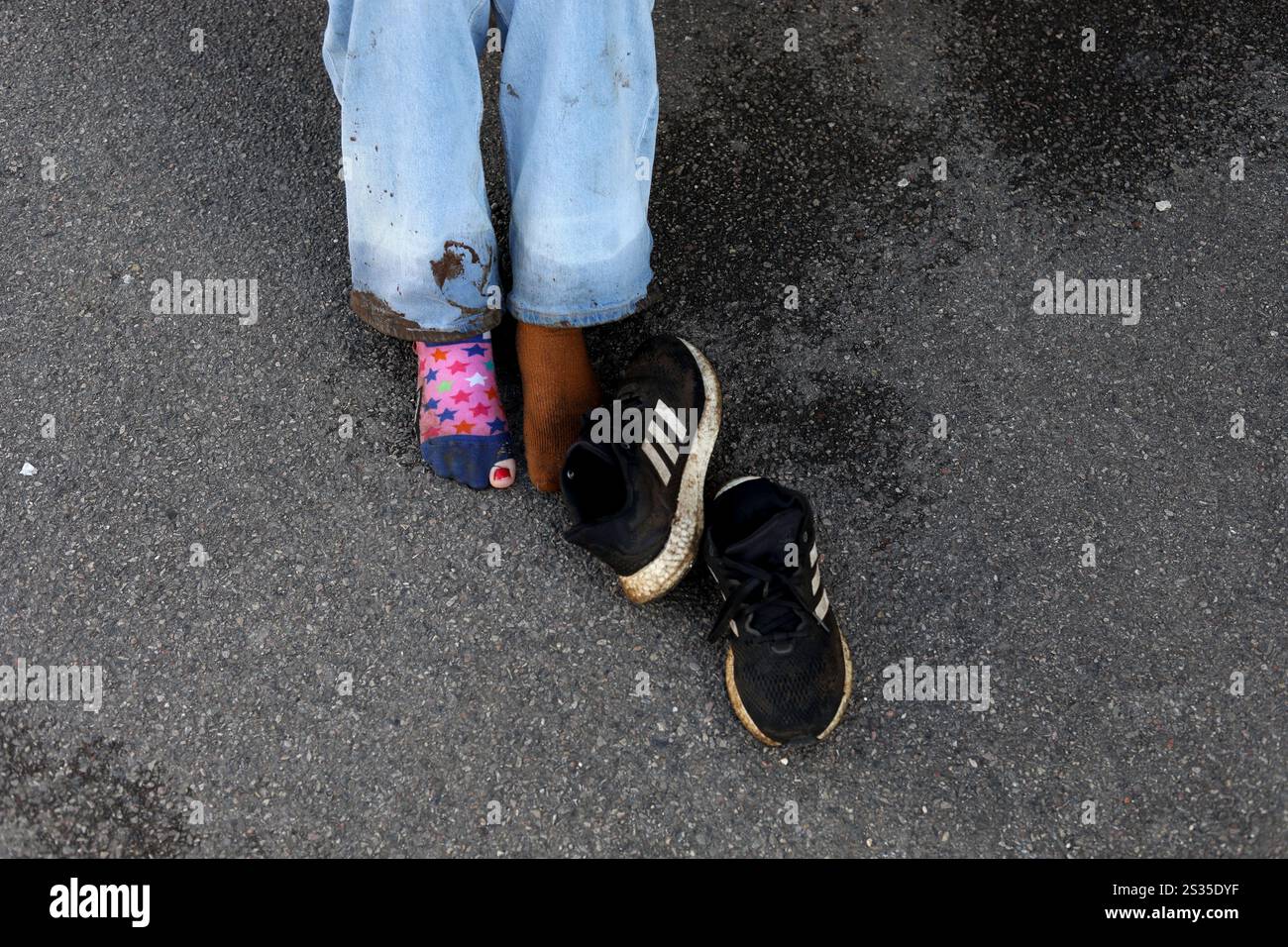 Young girl pictured with hole in her socks in London, UK Stock Photo ...