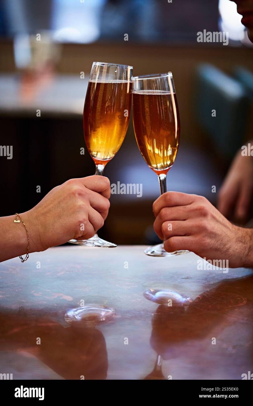Toast with a champagne cocktail Stock Photo - Alamy