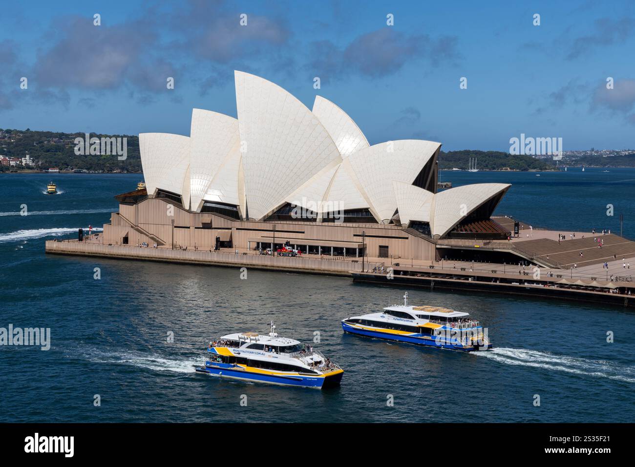 Sydney,Australia, Manly fast ferry vessels pass Sydney Opera House at ...
