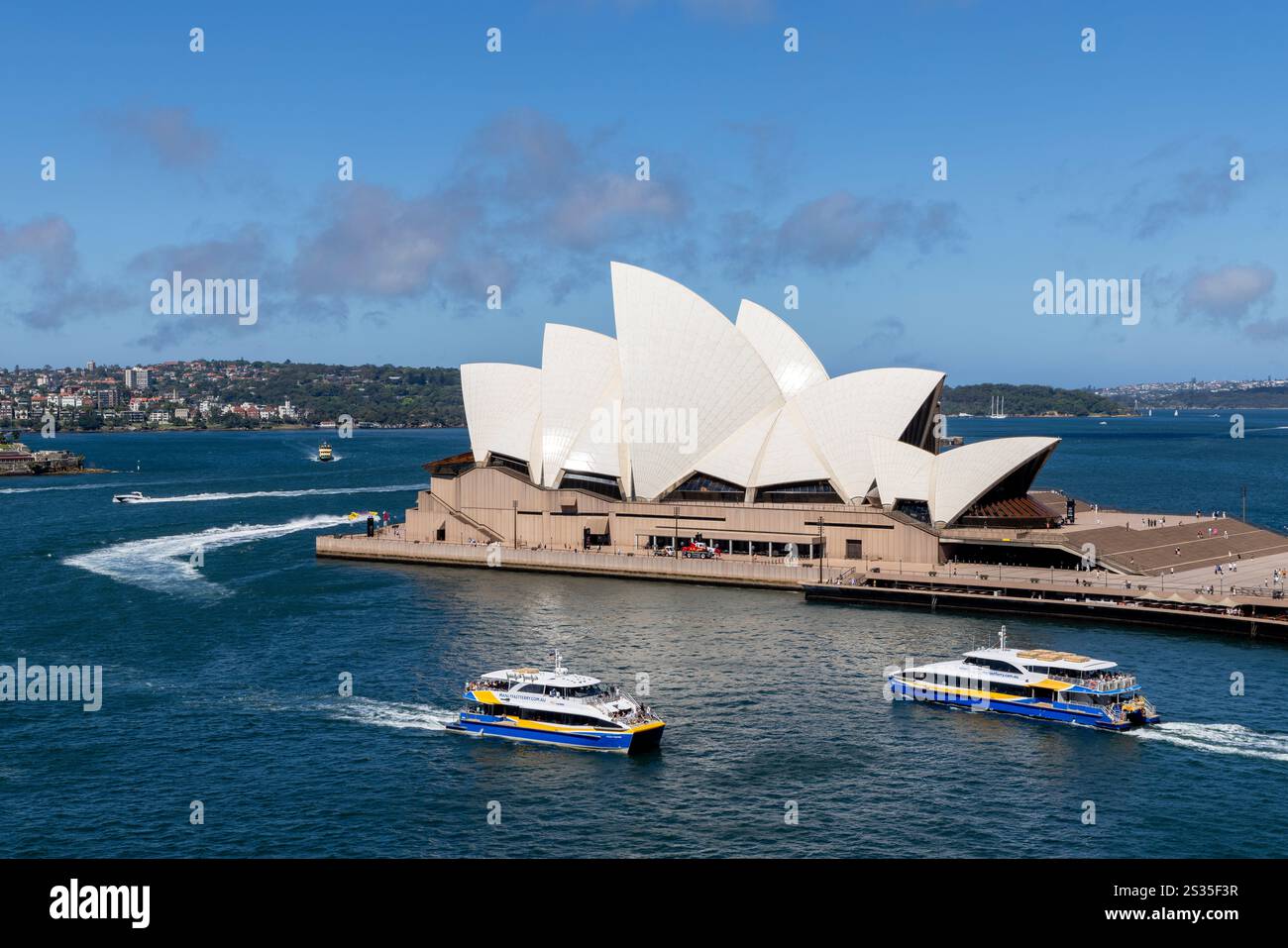 Sydney,Australia, Manly fast ferry vessels pass Sydney Opera House at ...