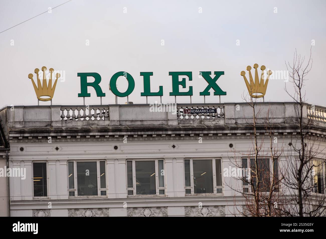 The logo of Swiss watch manufacturer Rolex sits on a rooftop in ...