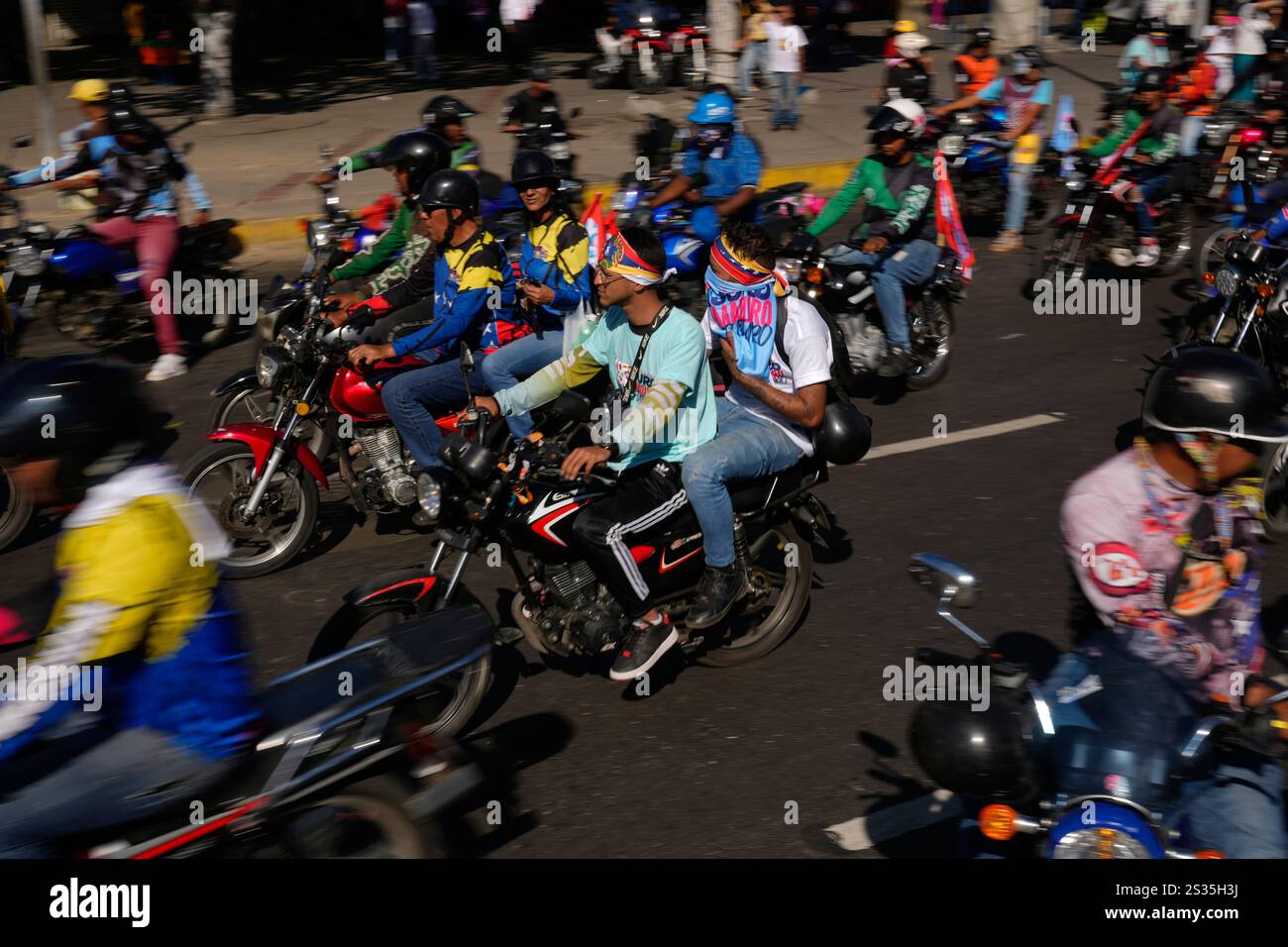 Motorcyclists participate in a rally in support of President Nicolas ...