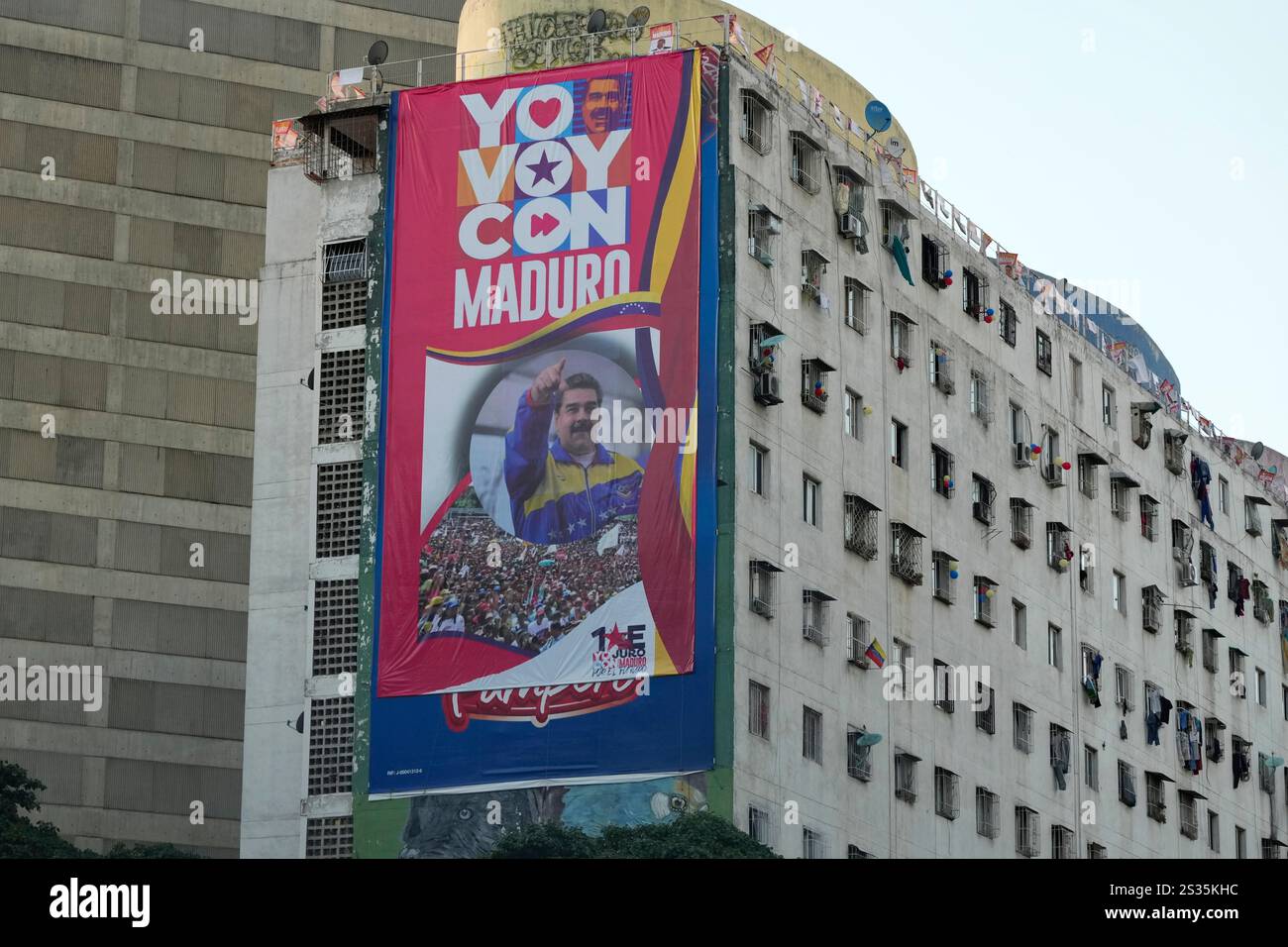 A campaign banner of President Nicolas Maduro adorns a building in ...