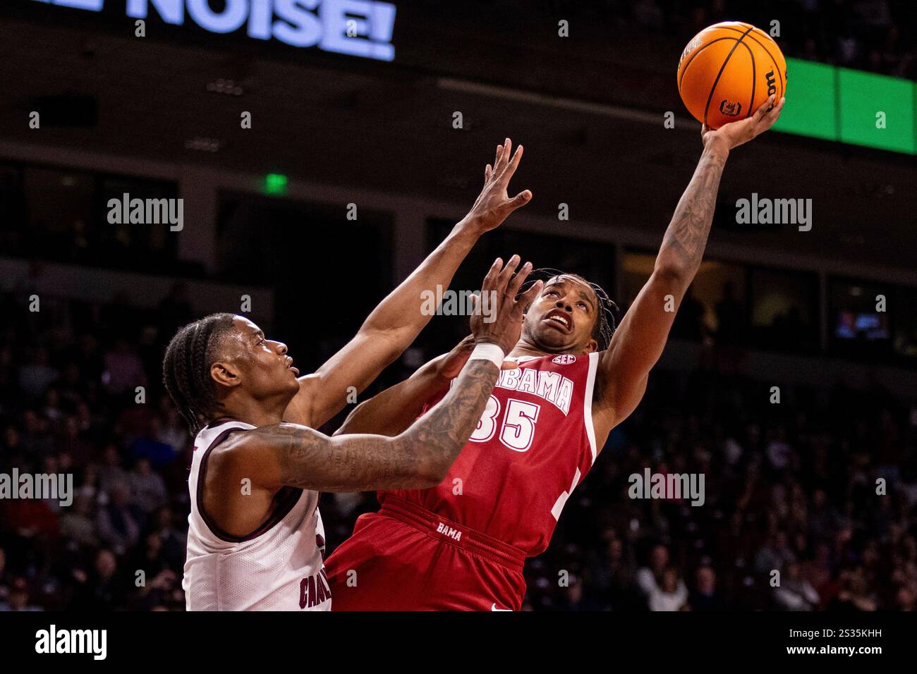 Alabama forward Derrion Reid shoots on South Carolina forward Nick ...