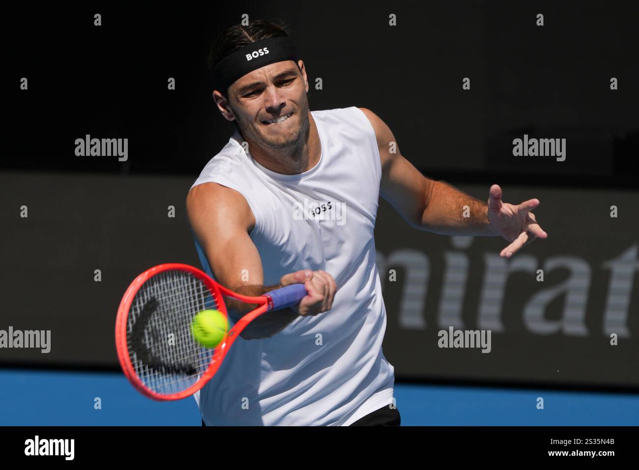 Taylor Fritz of the United States plays a forehand return during a ...