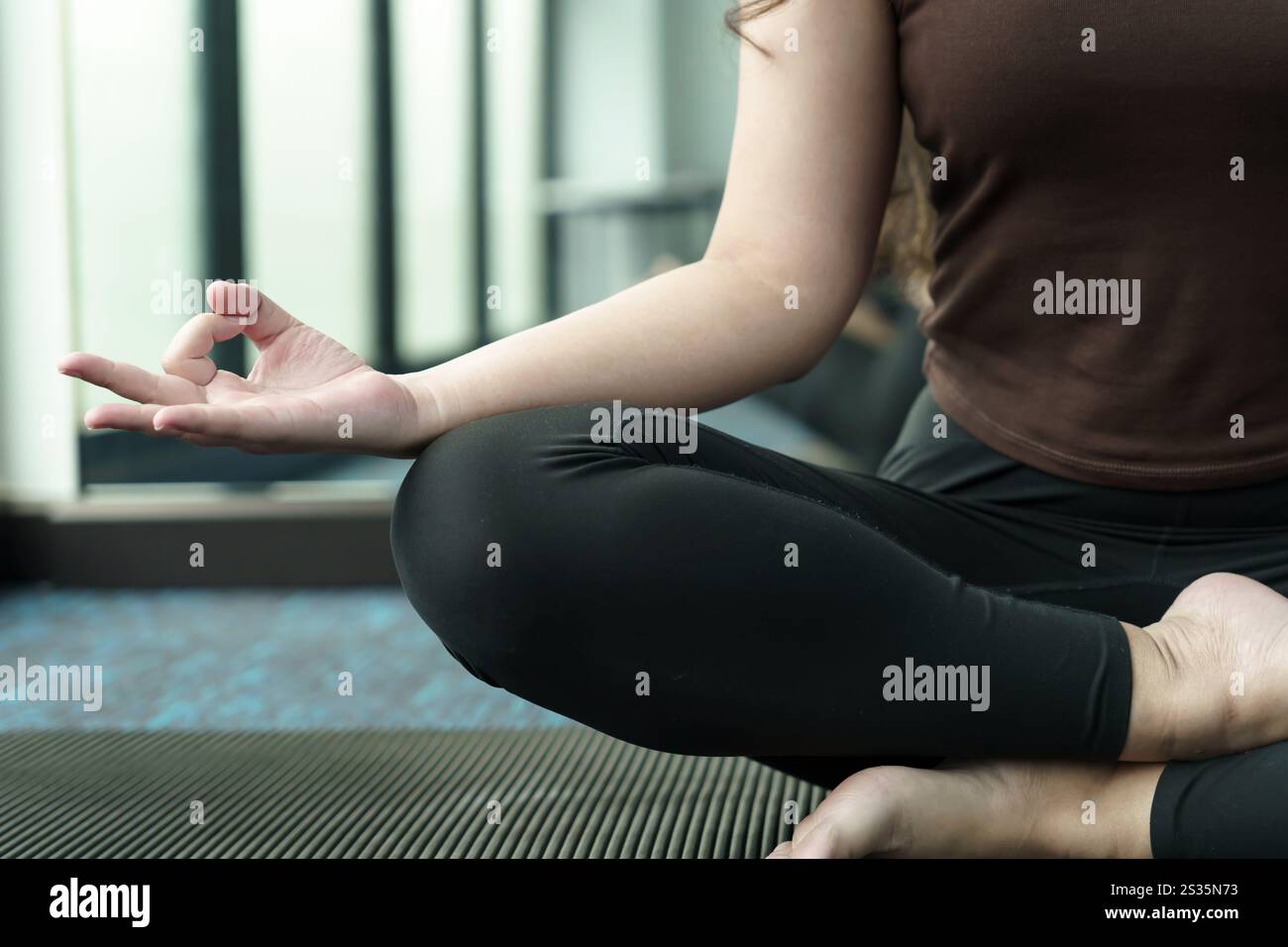 Easy Seat pose Female Attractive asian woman doing yoga stretching ...
