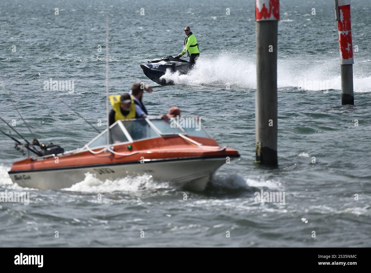Melbourne, Australia. 09th Jan, 2025. A fishing boat passes Water ...