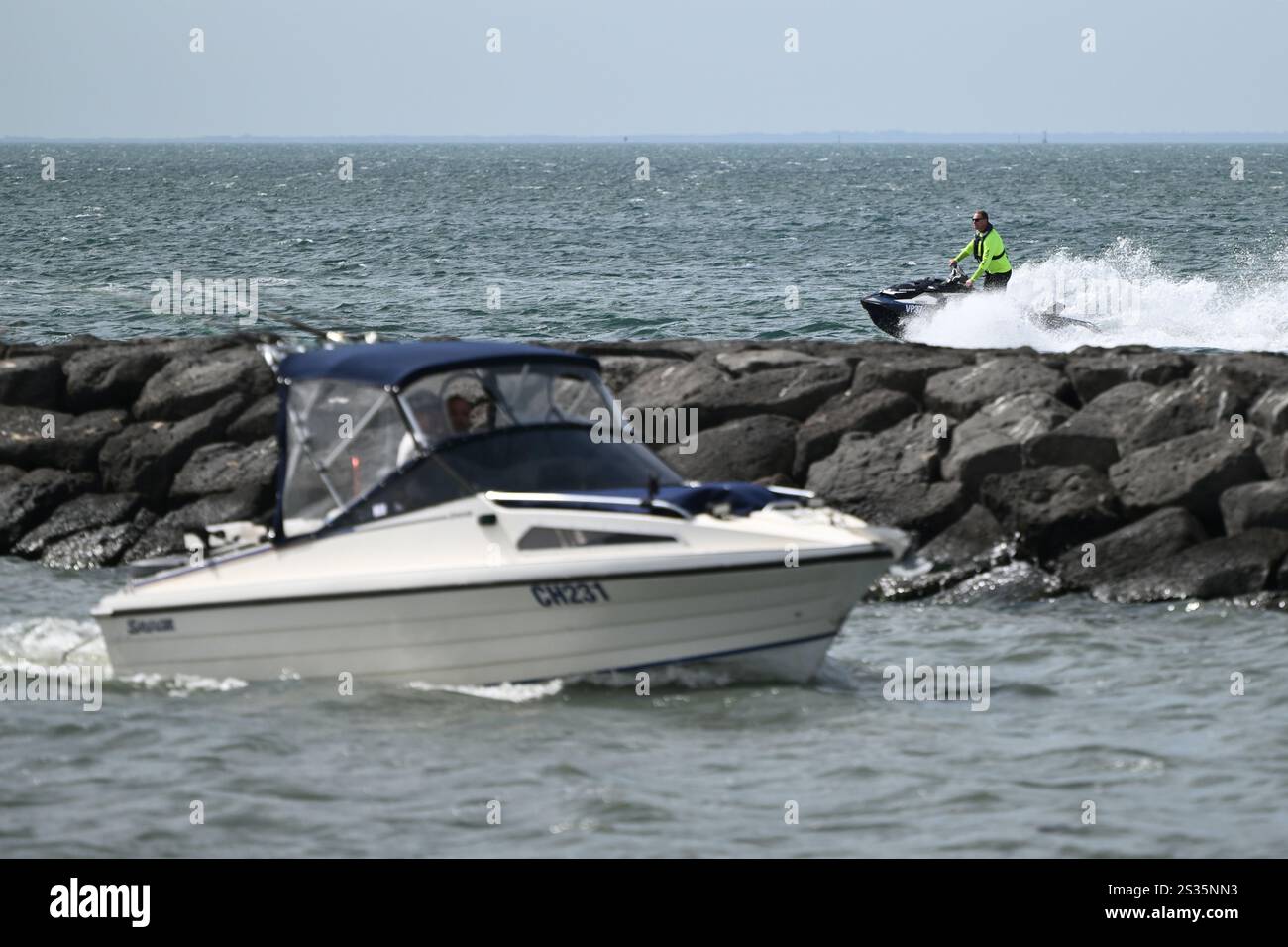 Melbourne, Australia. 09th Jan, 2025. A fishing boat passes Water ...