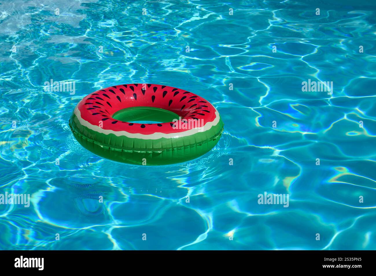 Swimming ring. Circle ring float in swimming pool. Toy for water and beach. Summer background ...