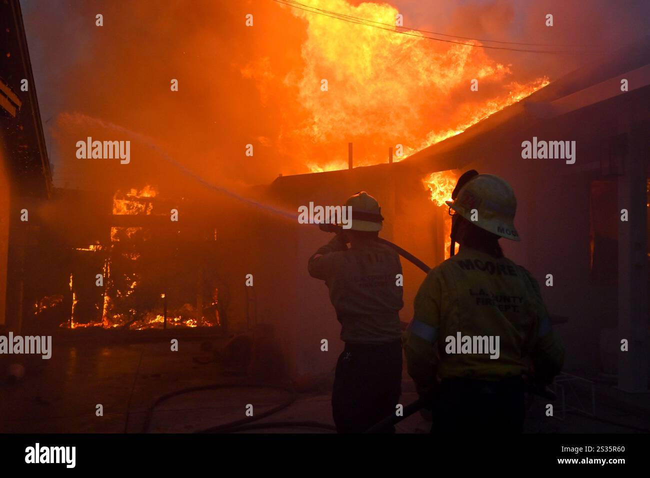 Firefighters battle the Eaton Fire as it engulfs structures Wednesday ...