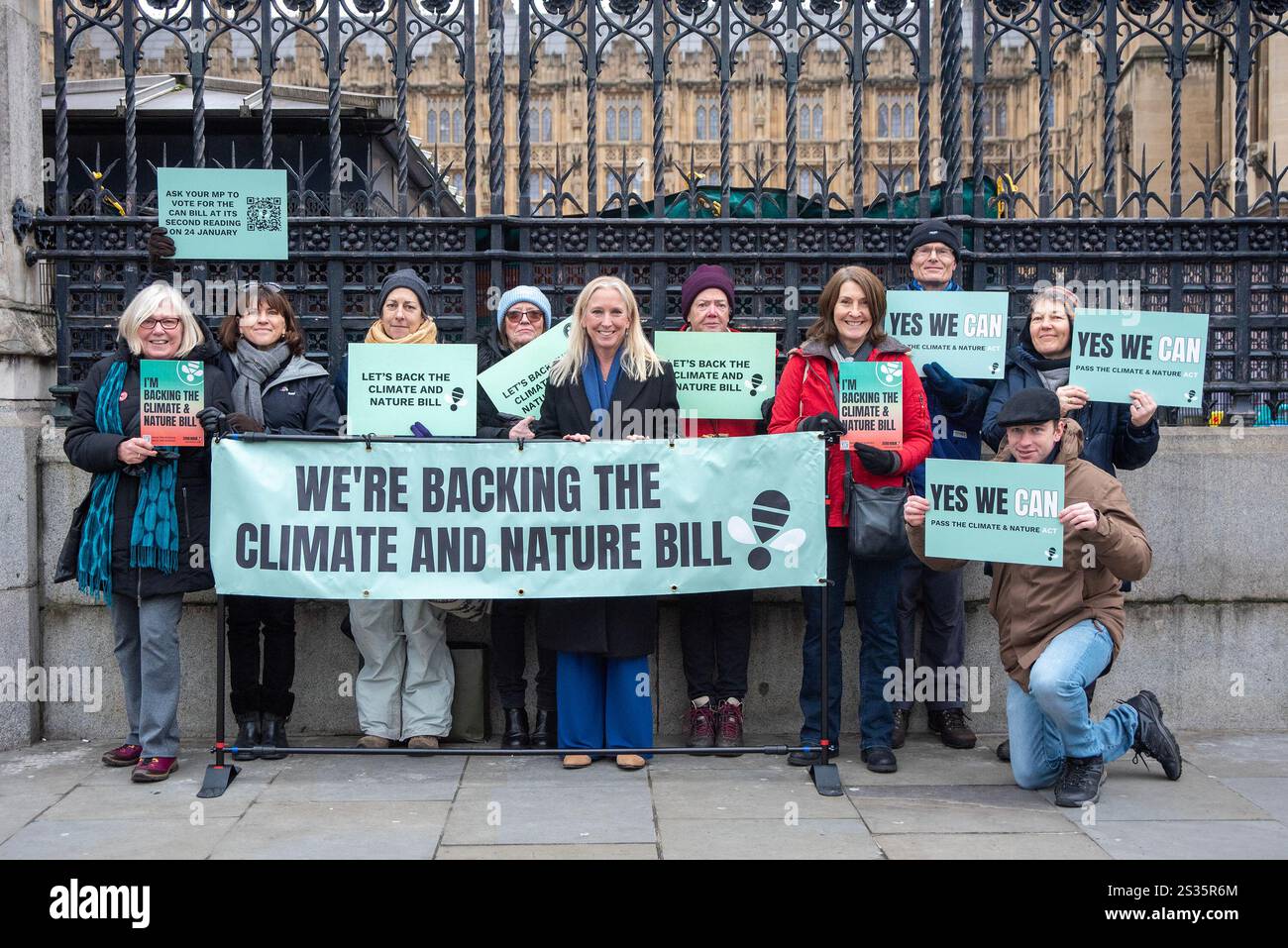 Activists pose for a group photo with a member of Parliament, Dr. Roz ...