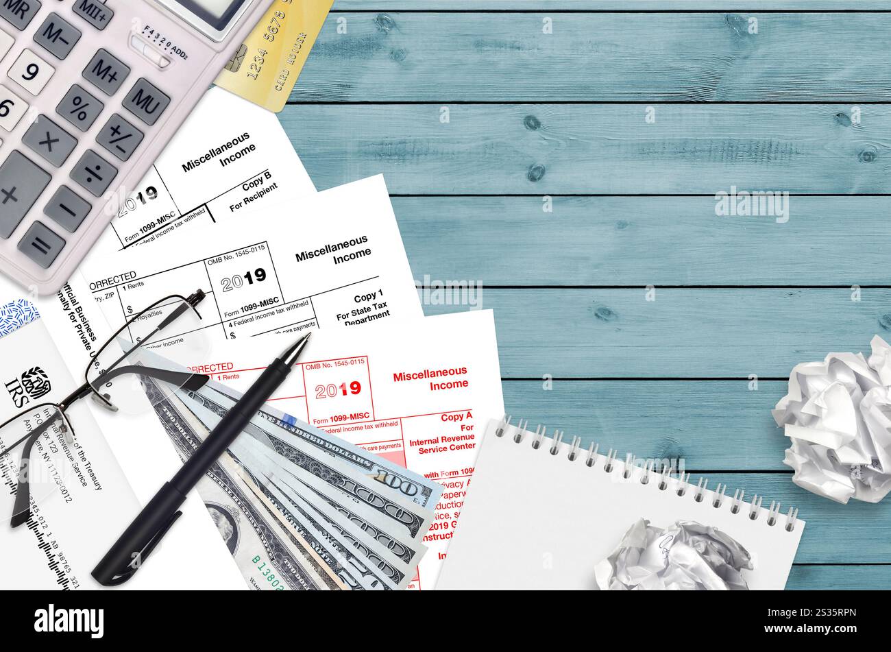 IRS form 1099-MISC Miscellaneous income lies on flat lay office table ...