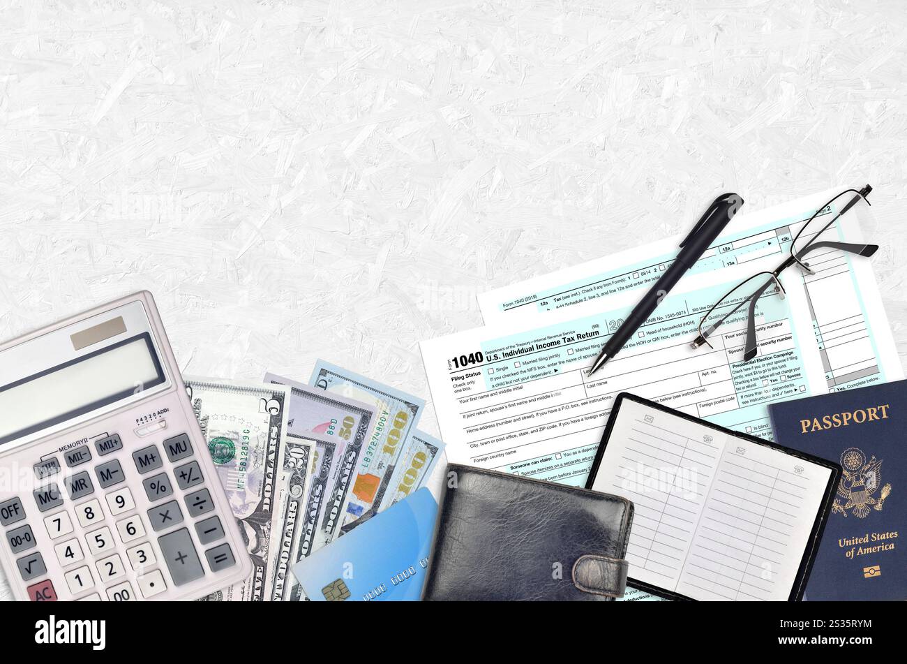 IRS form 1040 Individual income tax return lies on flat lay office ...