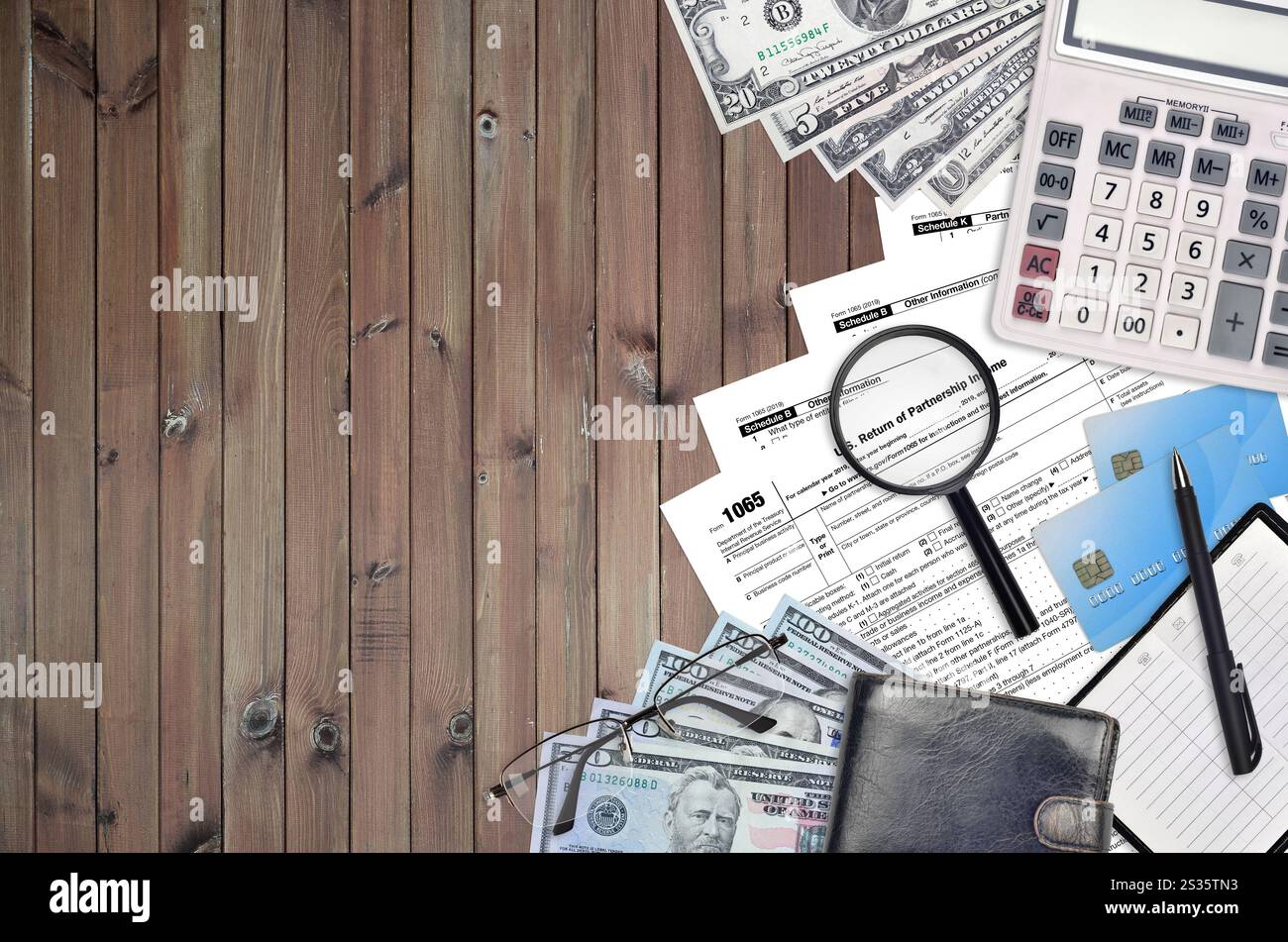 IRS form 1065 U.S. Return of partnership income lies on flat lay office ...
