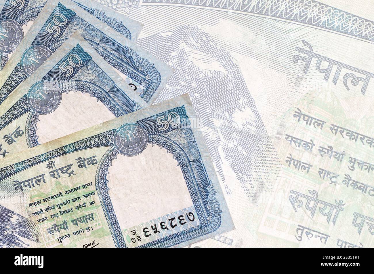 50 Nepalese rupees bills lies in stack on background of big semi ...