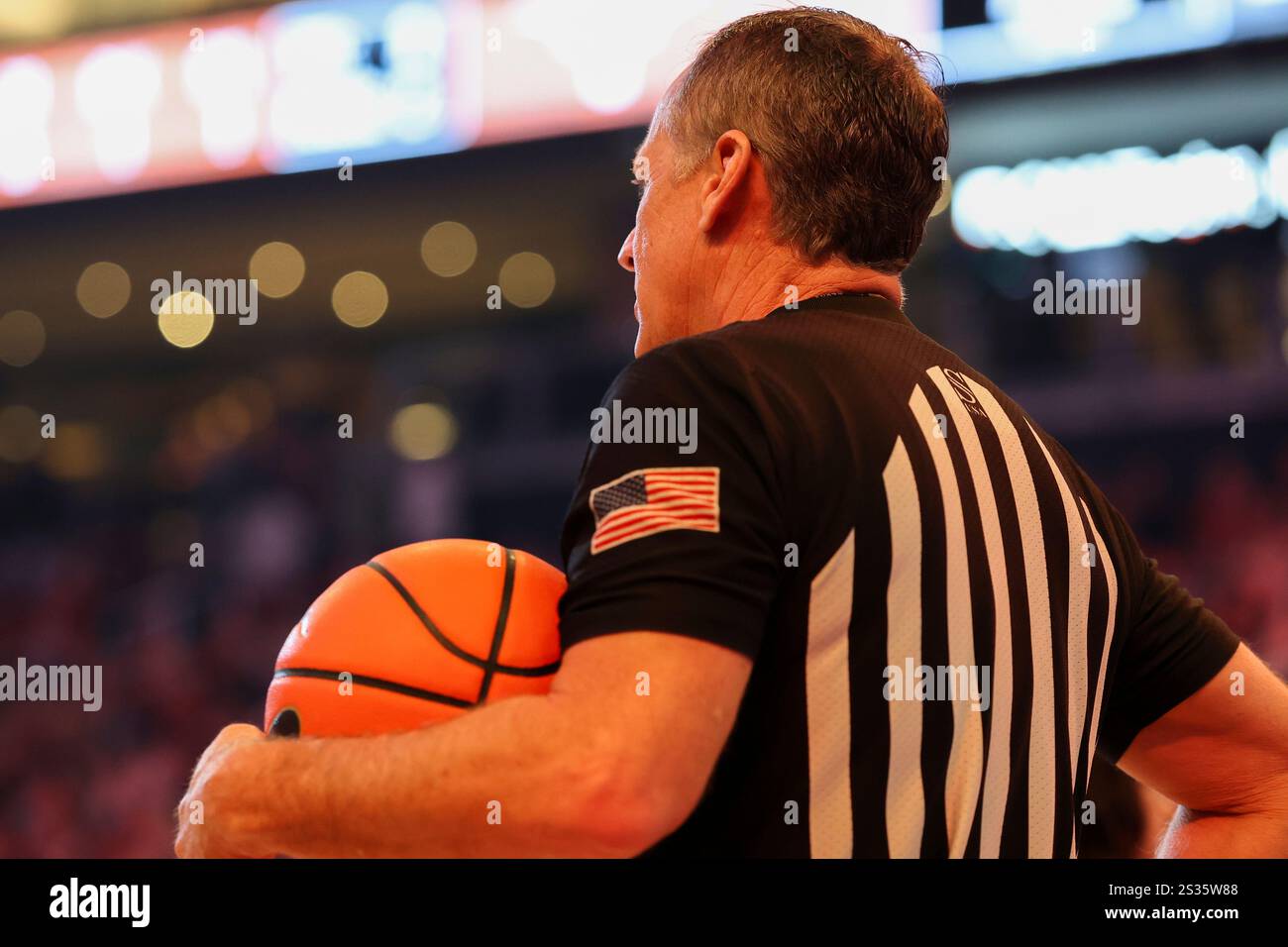 AUSTIN, TX - JANUARY 07: A referee holds the ball during a timeout of the college basketball ...
